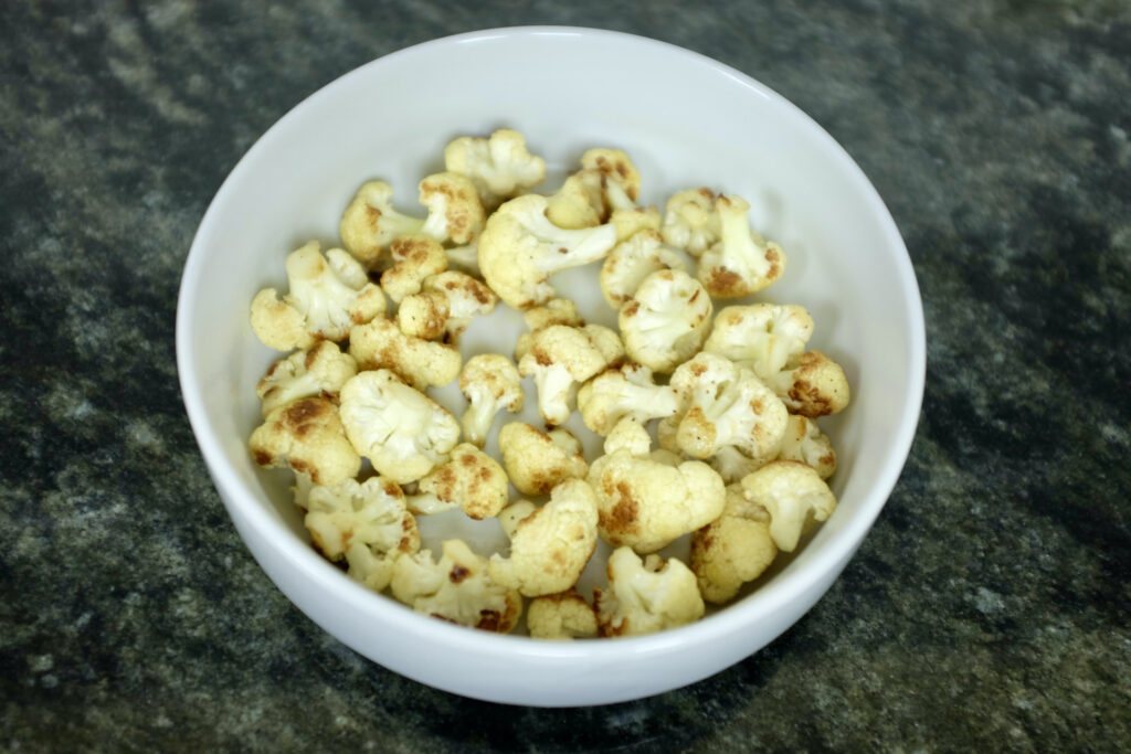 Small cauliflower florets roasted in olive oil - Nielsen Good Food