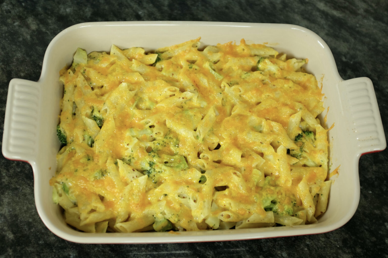 Baked broccoli and penne pasta gratinated with cheddar cheese - Nielsen ...